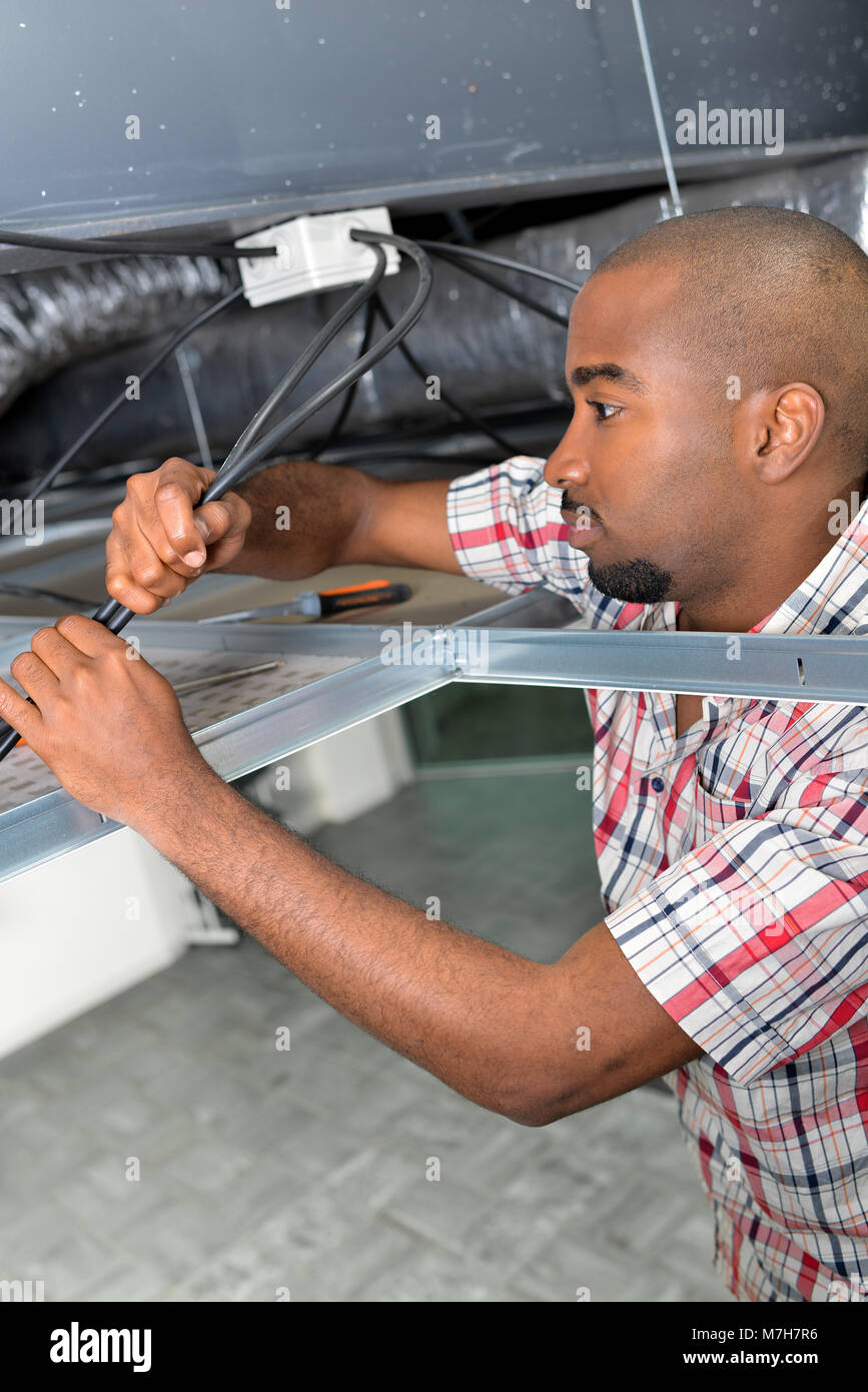 man gripping wire Stock Photo - Alamy