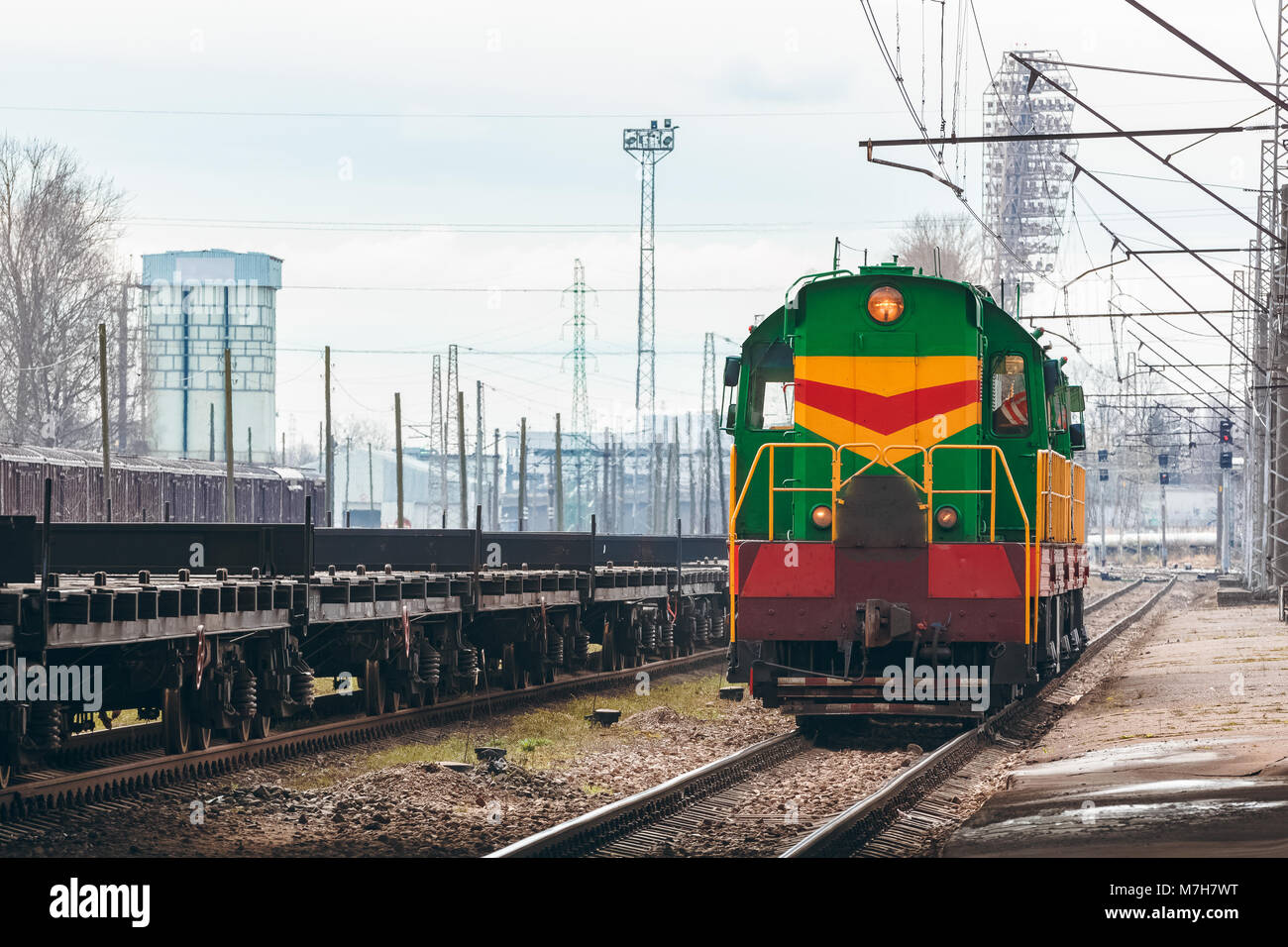 Green diesel cargo locomotive. Freight train in action Stock Photo - Alamy