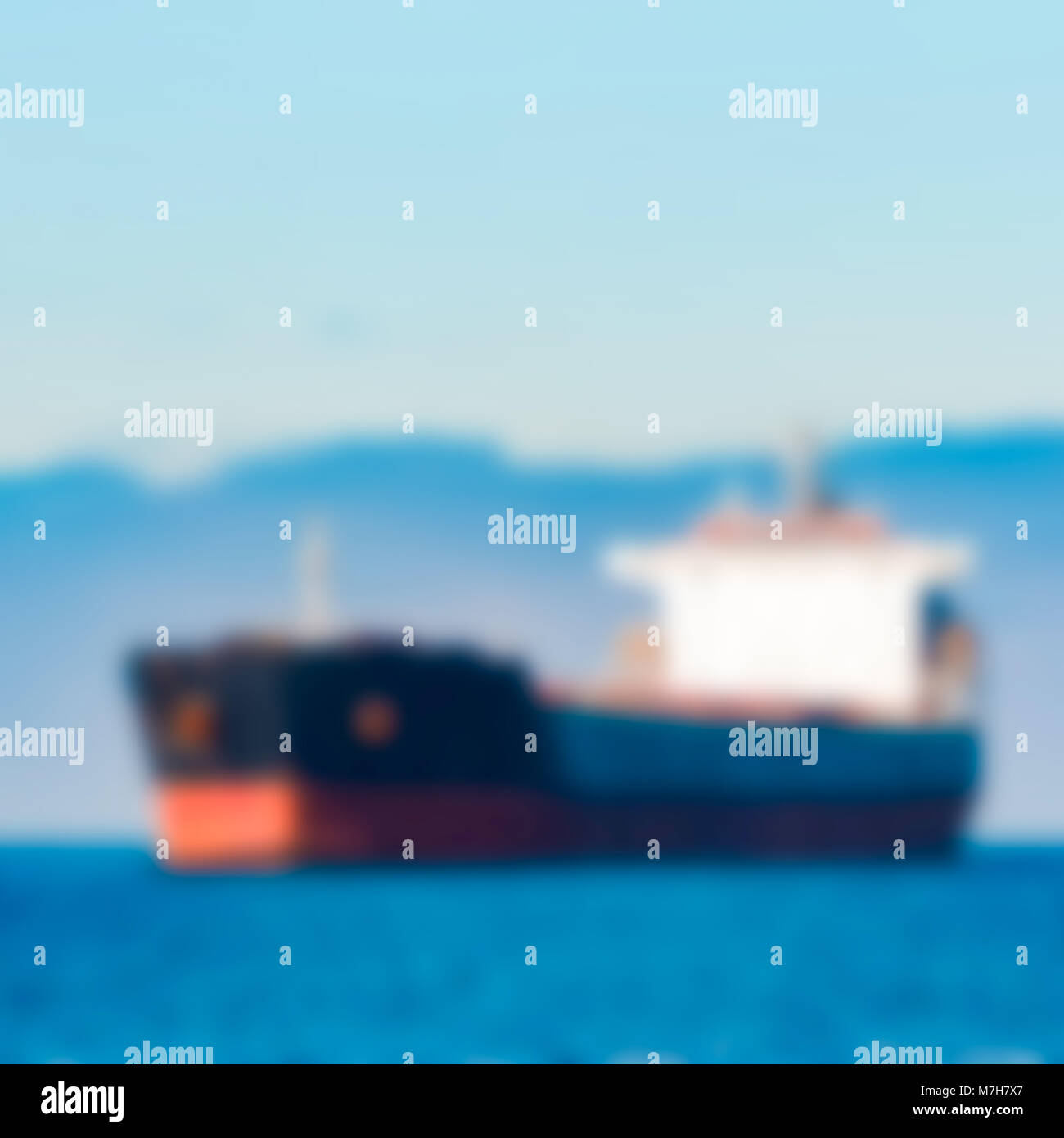 Cargo ship - soft lens bokeh image. Defocused background Stock Photo - Alamy