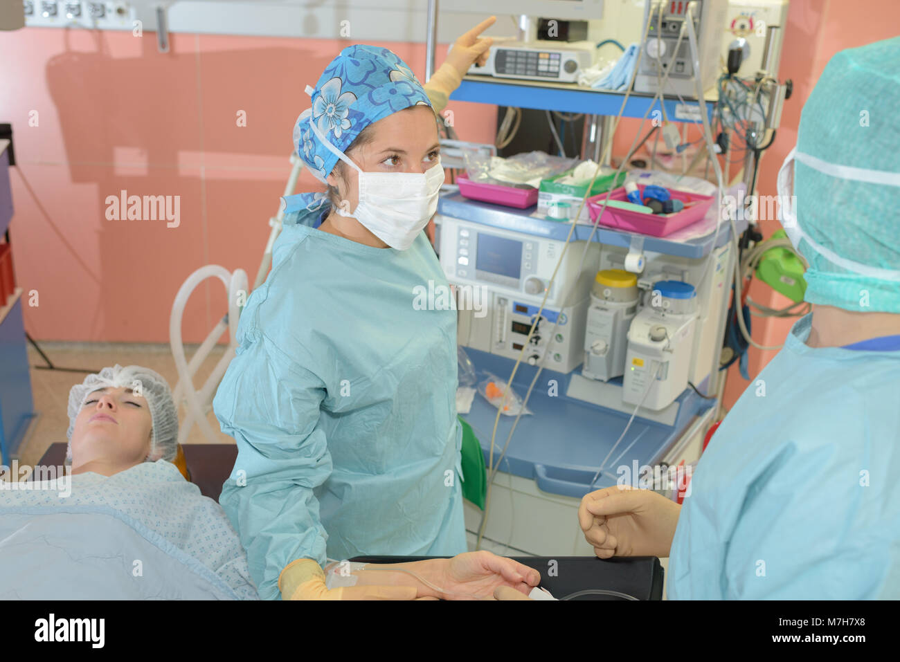 surgeons talking during operation Stock Photo - Alamy