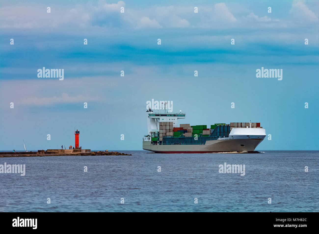 Grey container ship. Logistics and production import Stock Photo - Alamy