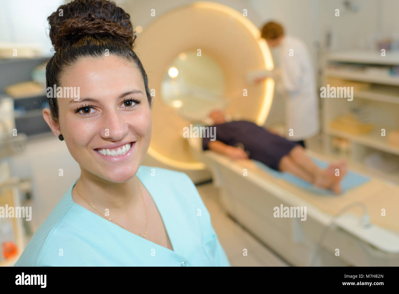 radiologist posing in front of a scanner Stock Photo - Alamy