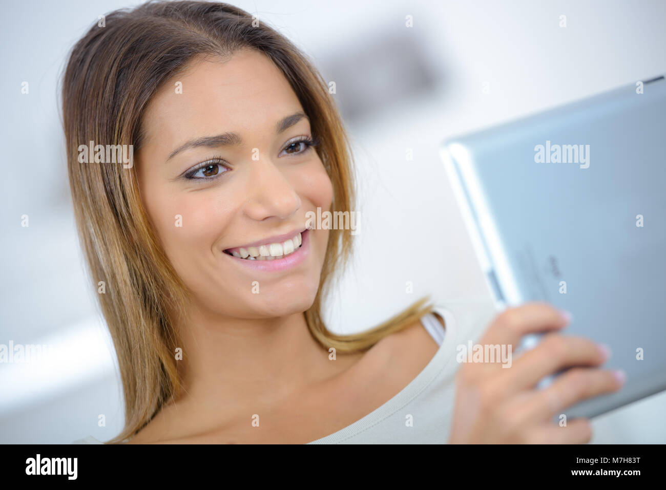 attractive beautiful young women using a tablet Stock Photo - Alamy