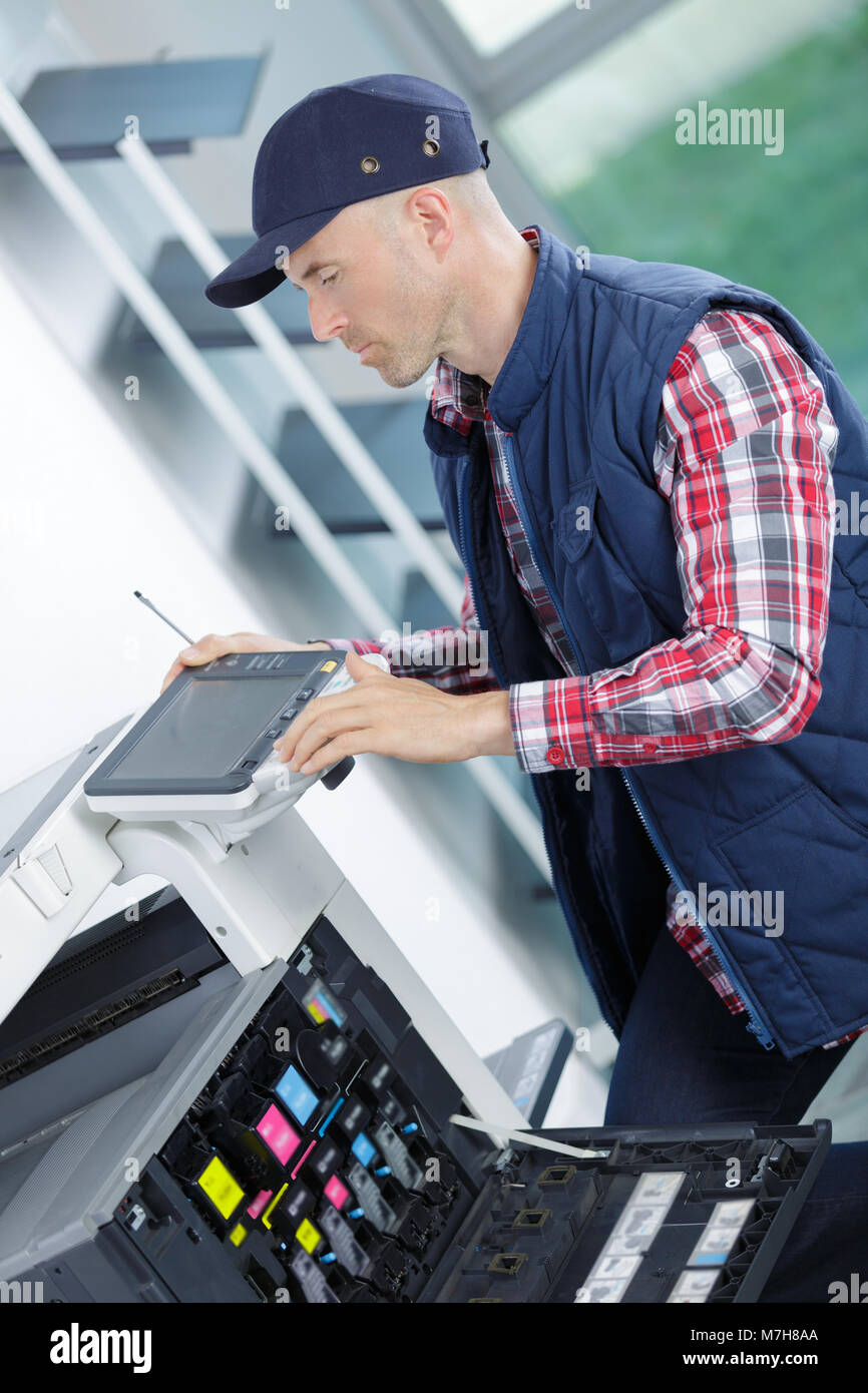 printer technician fixing a printer Stock Photo - Alamy