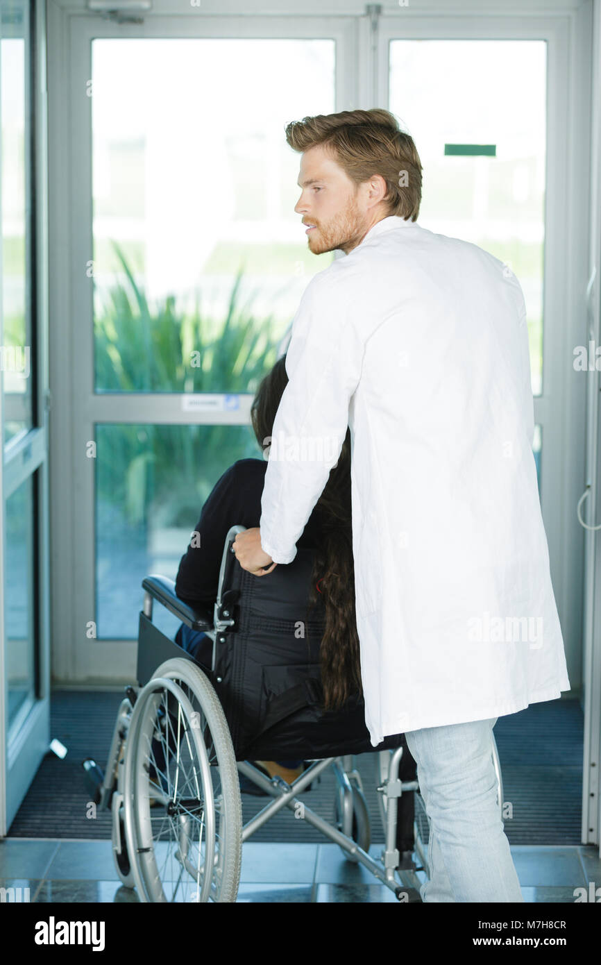 Nurse pushing old man in hi-res stock photography and images - Alamy