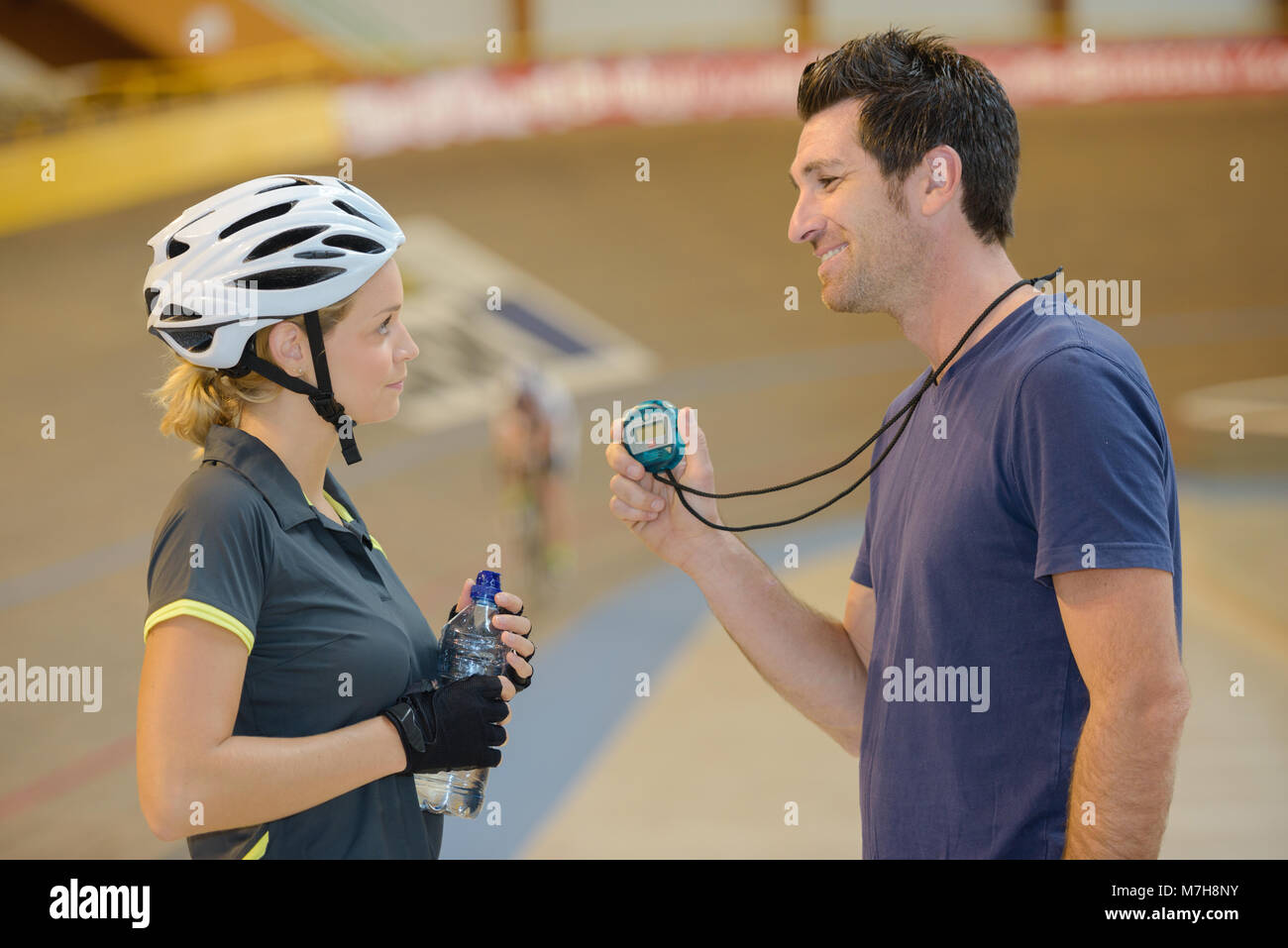 coach holding a timer Stock Photo - Alamy