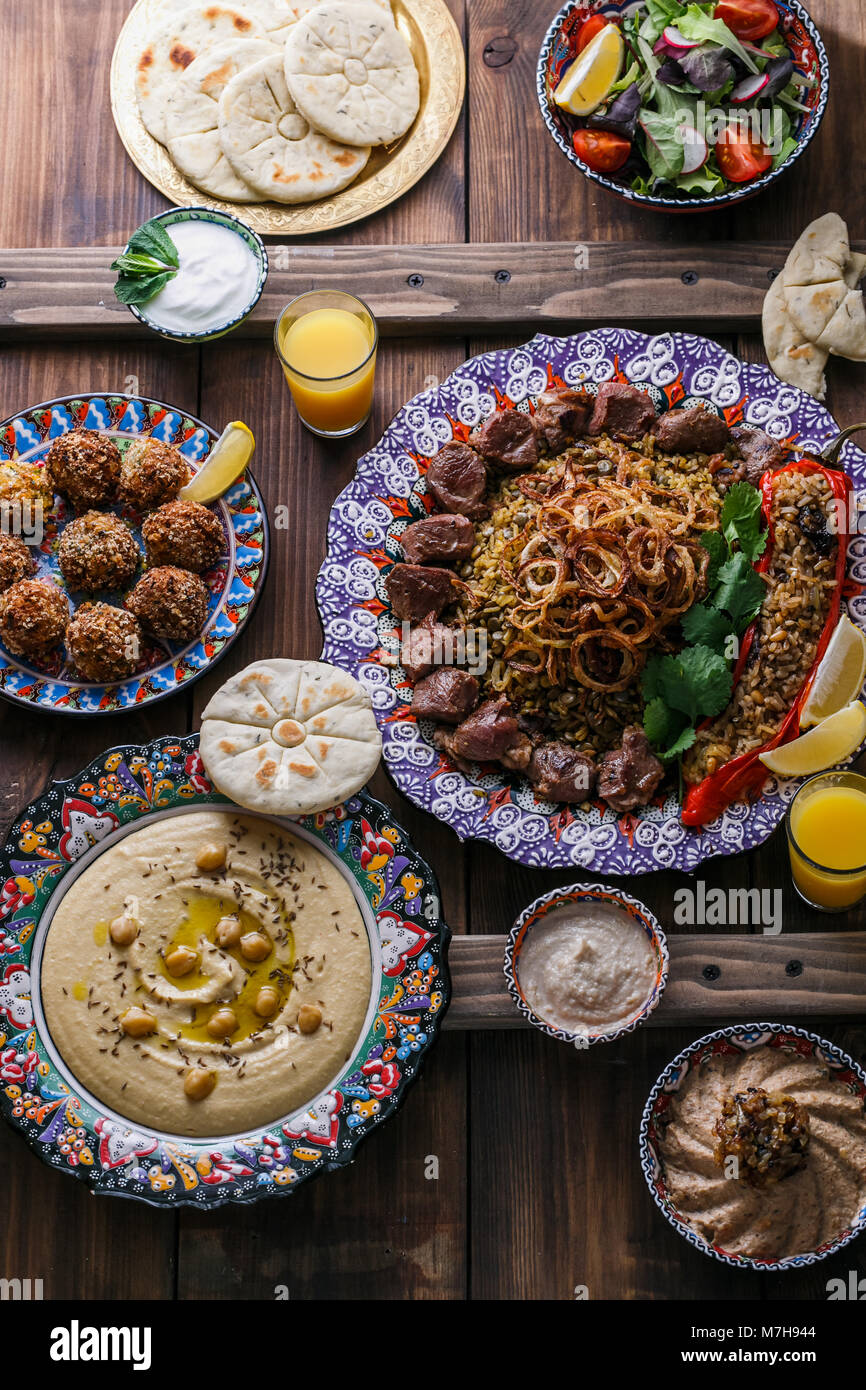 Middle eastern or arabic dishes and assorted meze on a dark background ...