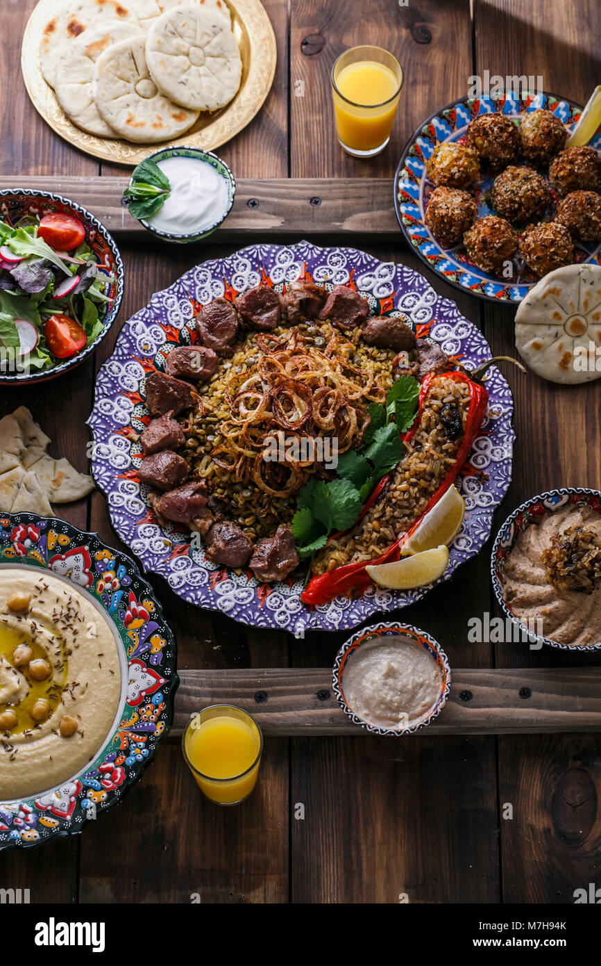 Middle eastern or arabic dishes and assorted meze on a dark background ...