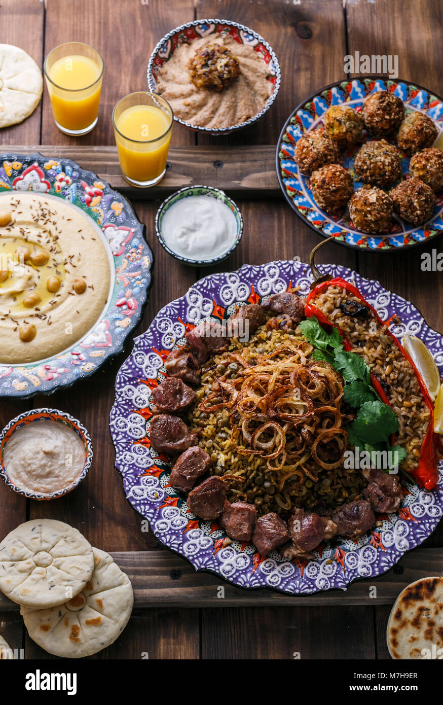Middle eastern or arabic pilaf with hummus, falafel, eggplant dip and ...