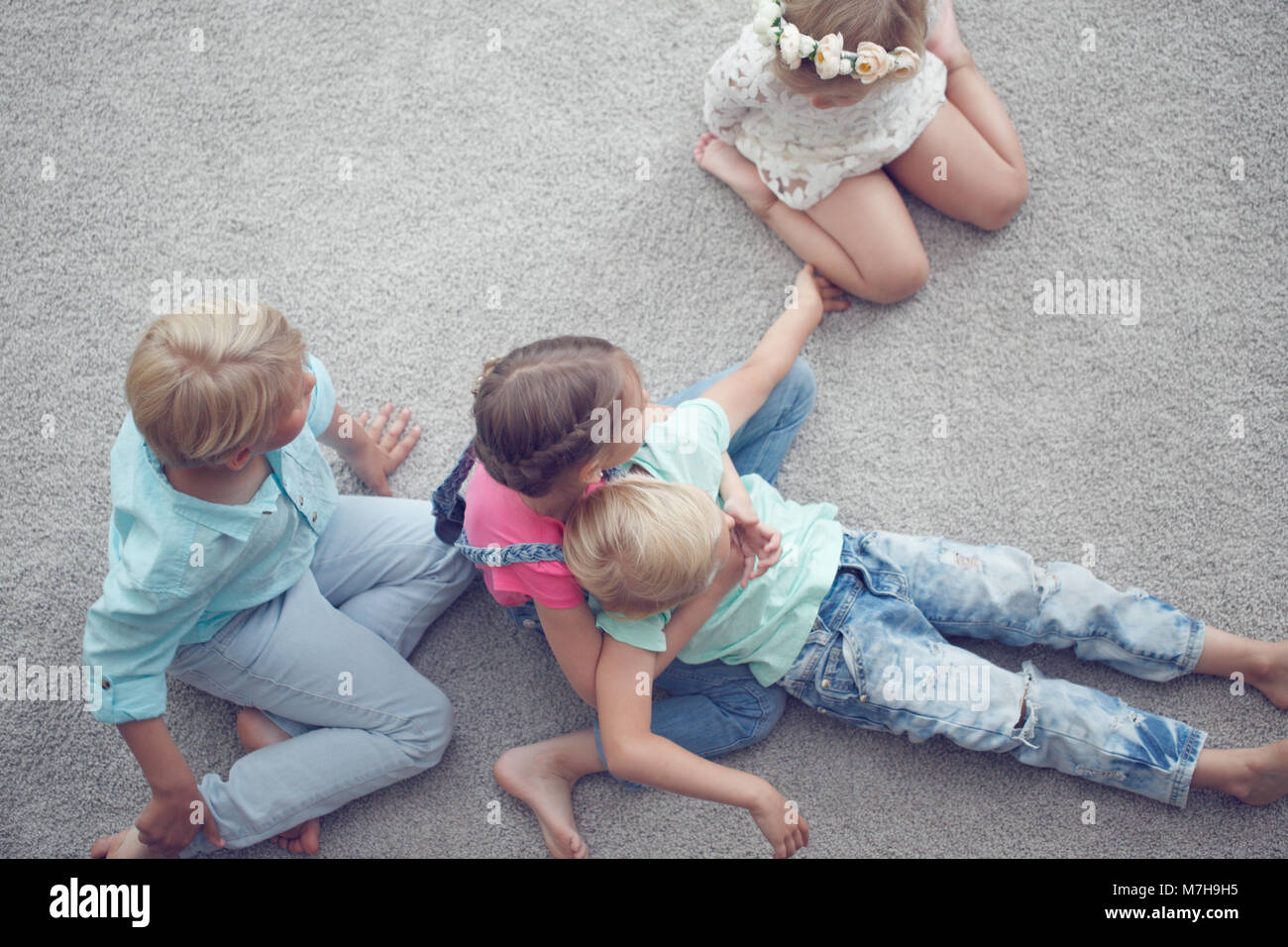 Kids playingon the floor, top view Stock Photo - Alamy