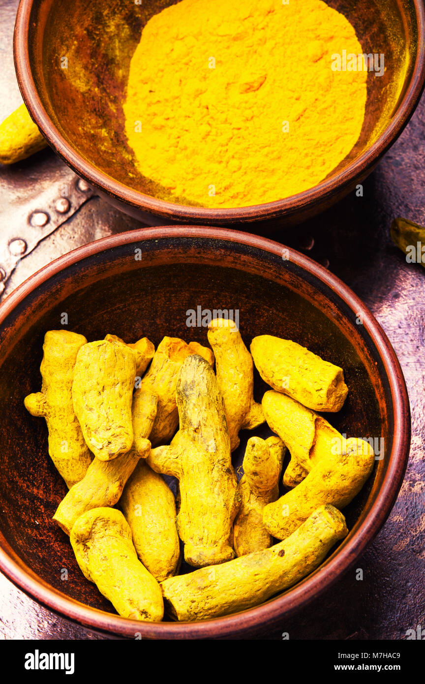 Turmeric powder and root turmeric in a bowl.Turmeric Spice Stock Photo ...
