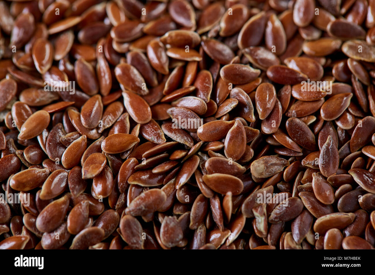 Top view close-up picture of separate flax seed on light textured ...