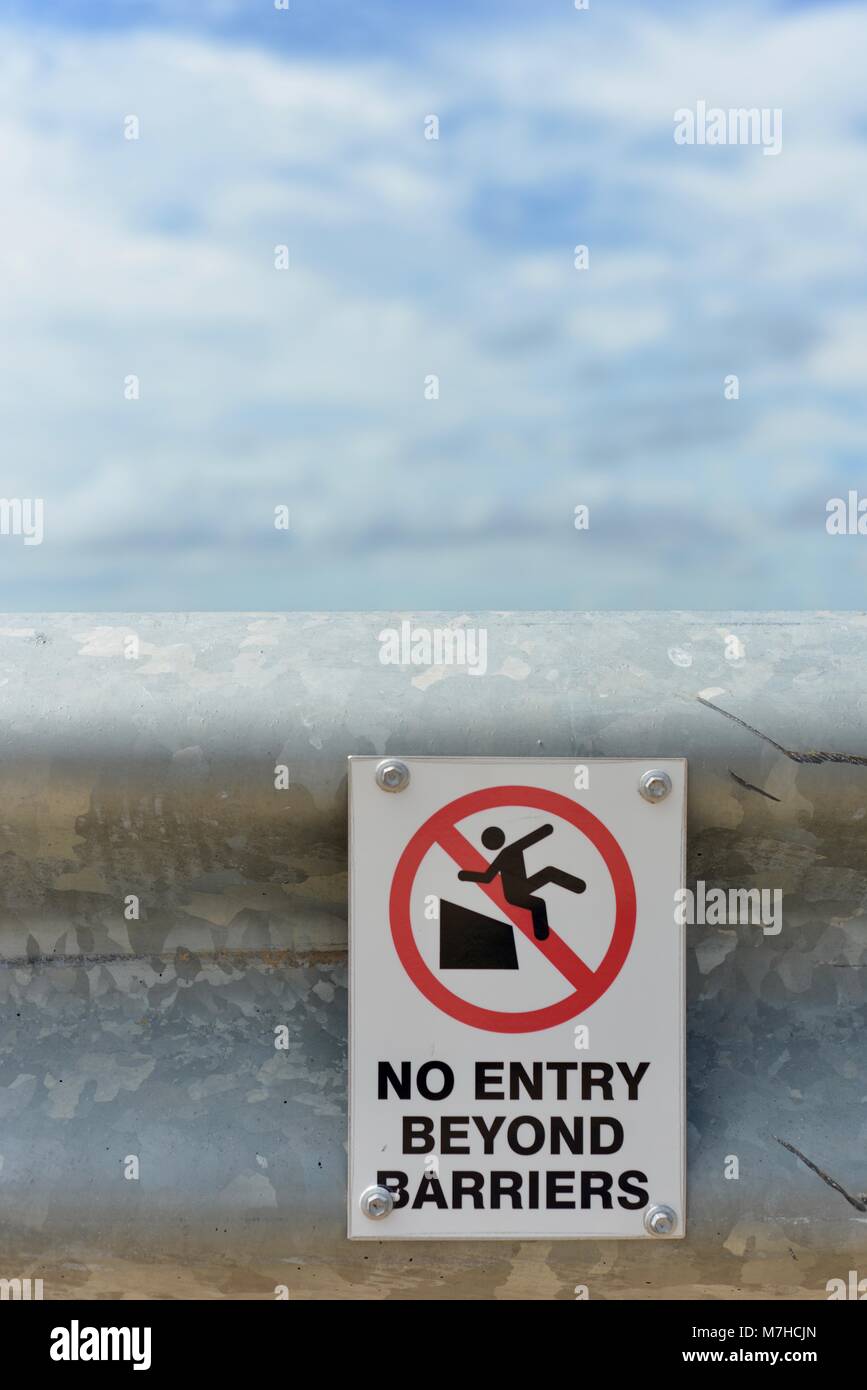 No entry beyond barriers sign on a guardrail, Ross River Dam, Ross Dam ...