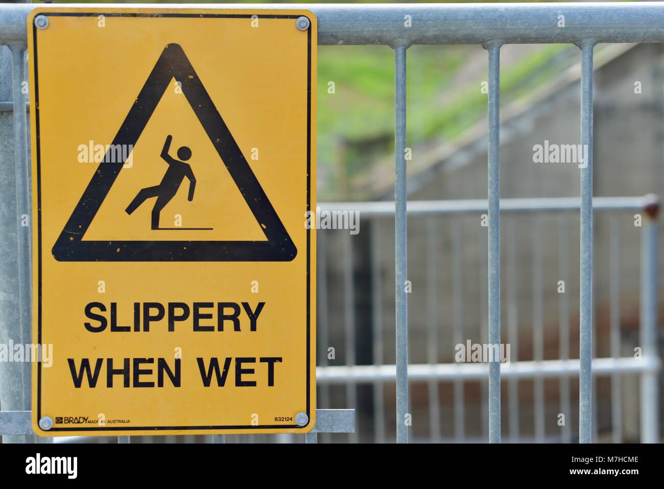 slippery when wet sign with image of man falling over, Ross River Dam ...