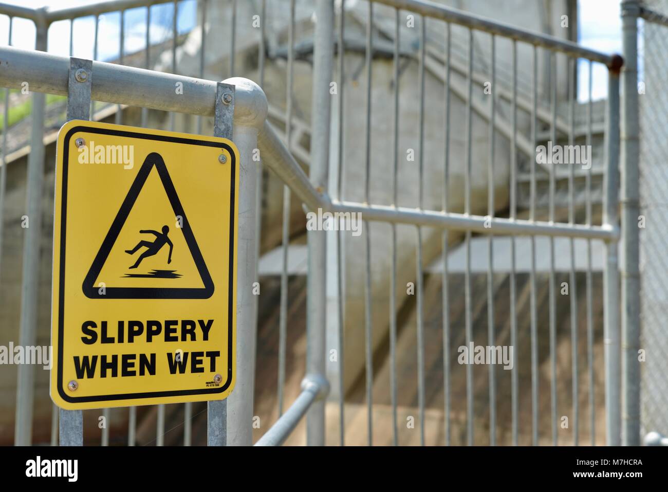 slippery when wet sign with image of man falling over, Ross River Dam ...