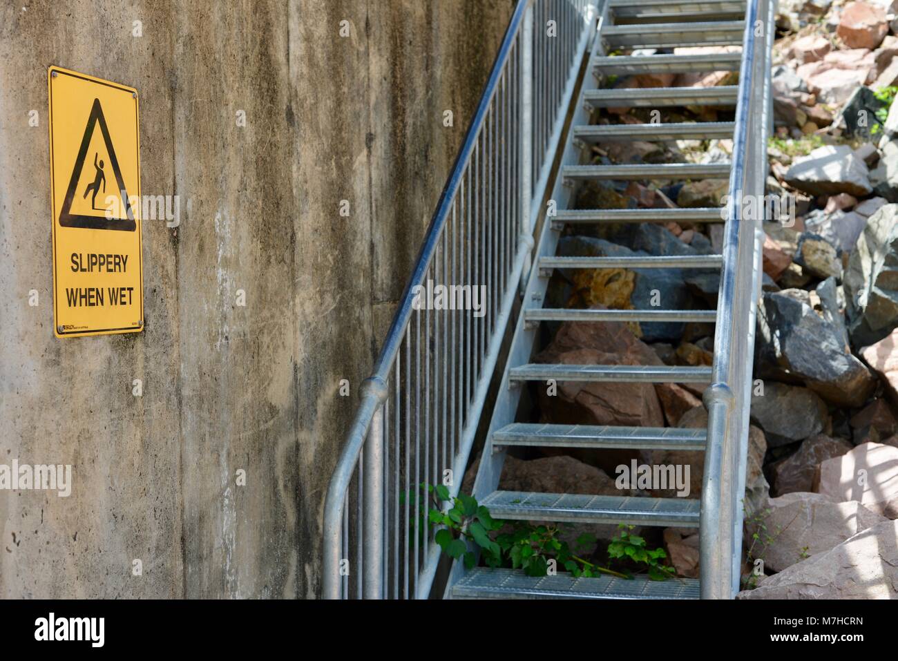 slippery when wet sign with image of man falling over, Ross River Dam ...