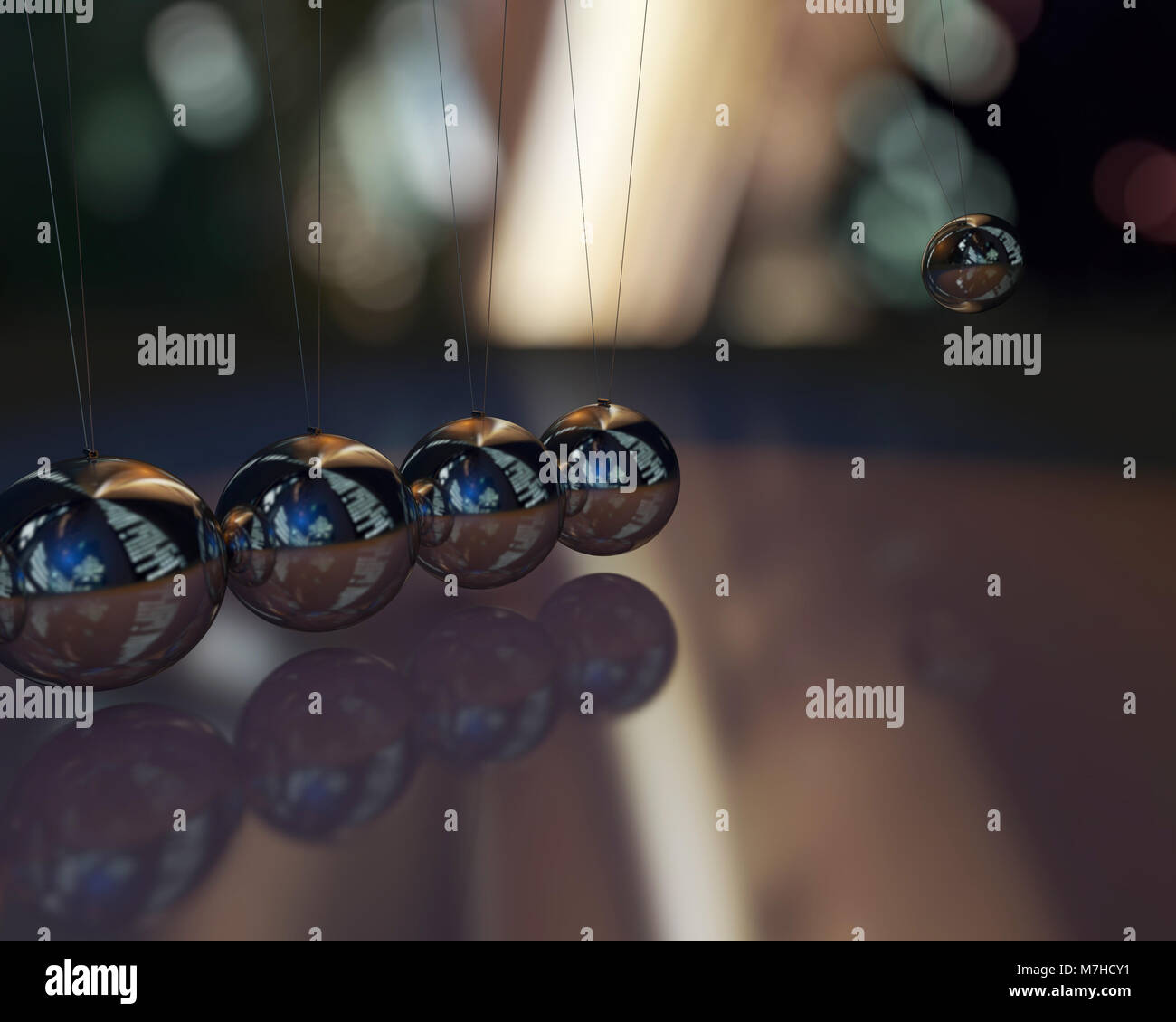 Colliding Newton balls, passing energy Stock Photo - Alamy