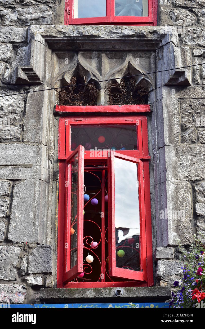 Vintage red painted wooden frame window in place of former double ...