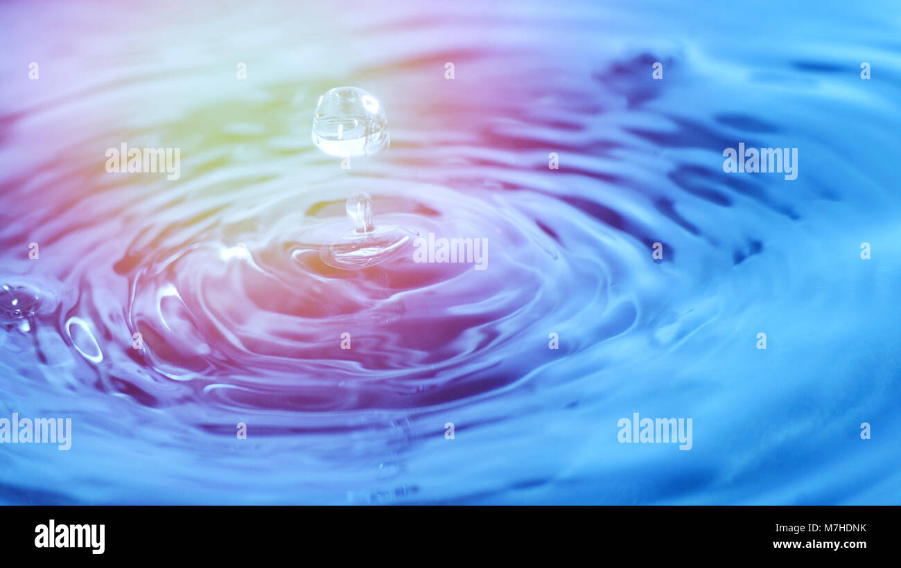 water drop, wave and splash in soft light Stock Photo - Alamy