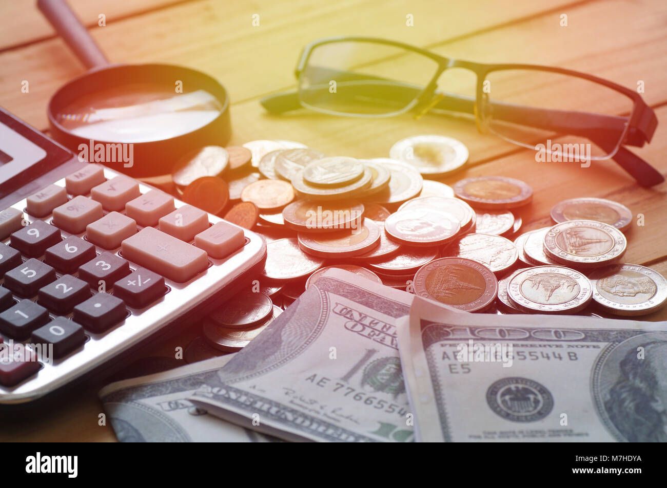 Business object with money coins on wood tabel Stock Photo - Alamy