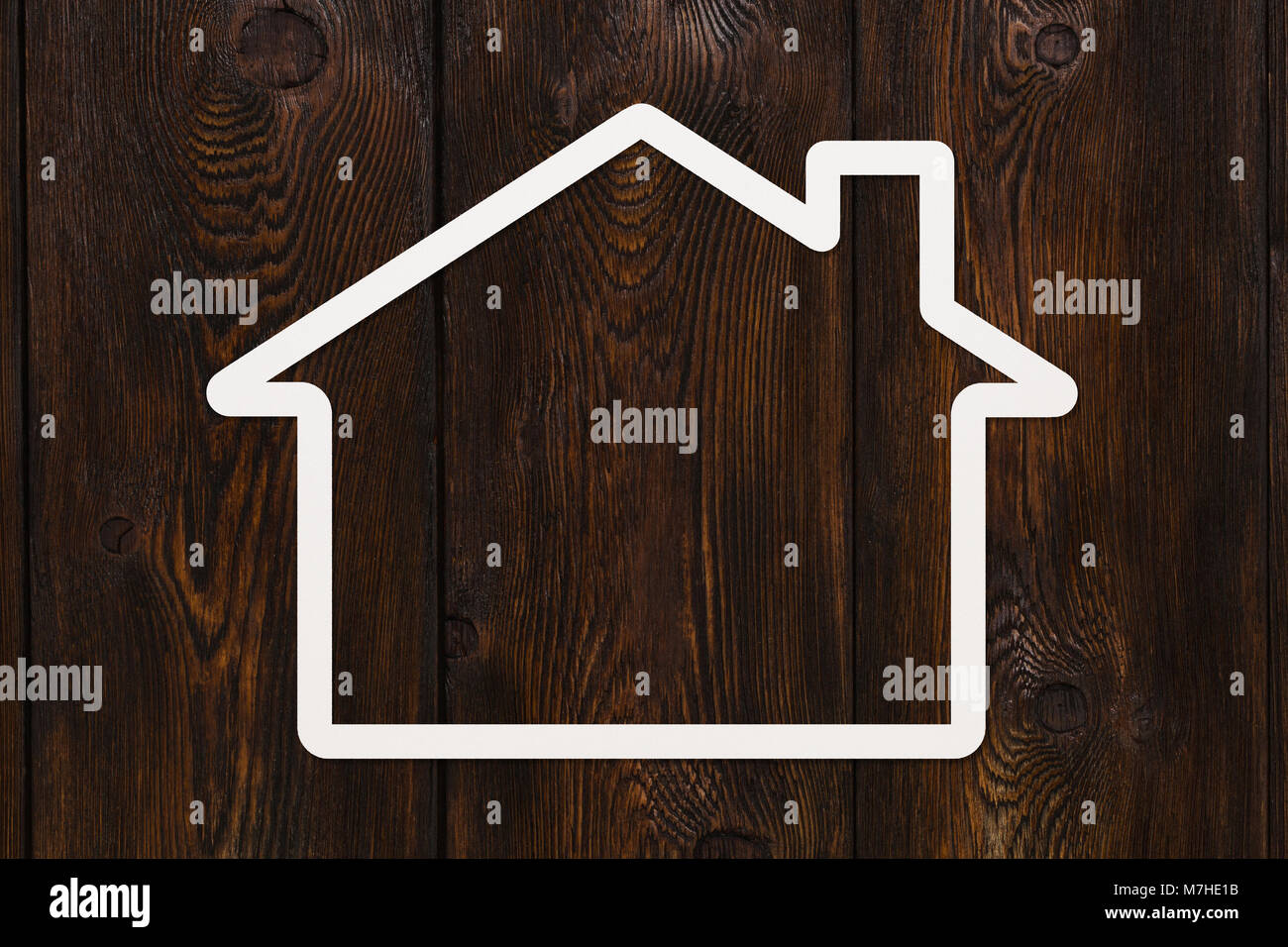 Paper house with copyspace on wooden background. Housing, family ...