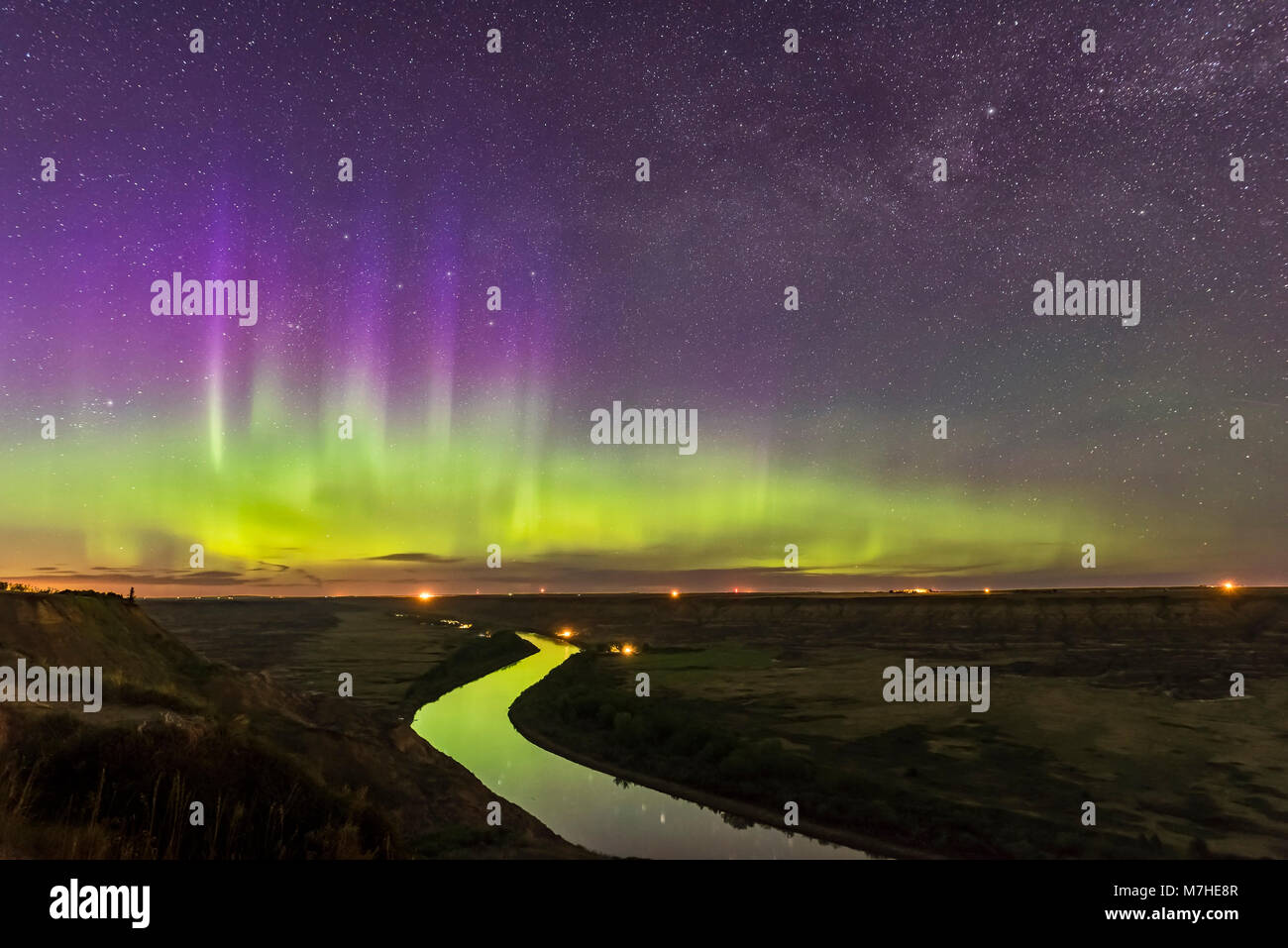 The northern lights dance over the Red Deer River and Badlands of ...