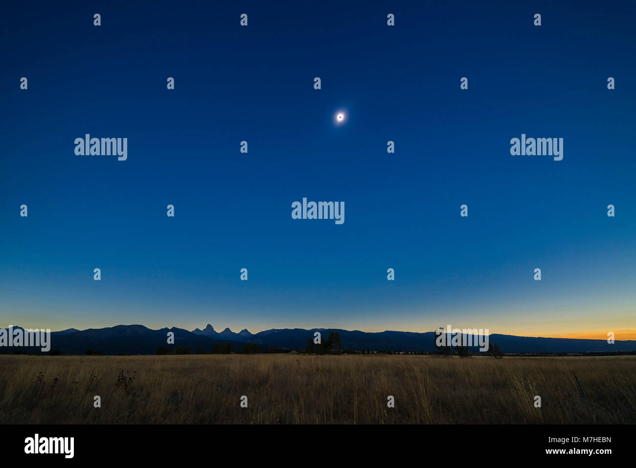 Total solar eclipse over the Grand Tetons in Idaho Stock Photo - Alamy