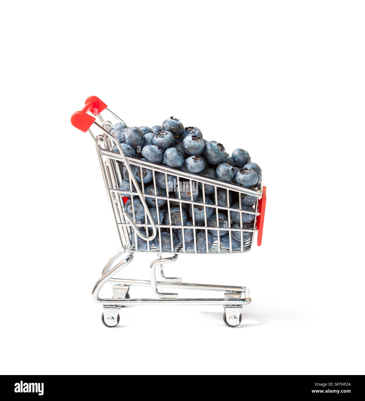 small shopping cart full of fresh blueberry isolated Stock Photo - Alamy