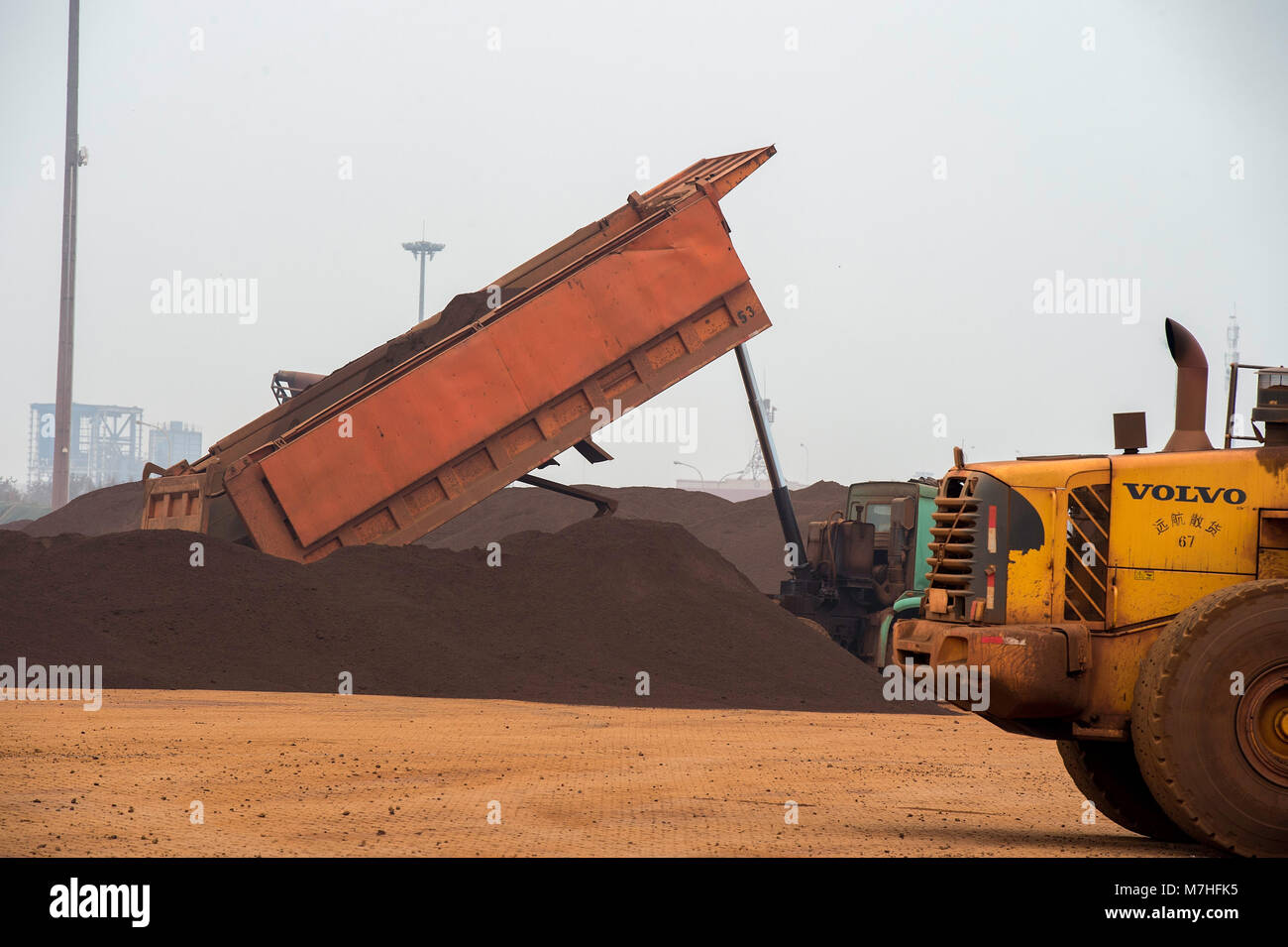 Iron Ore stockpile storage on the docks in Tianjin Port China Stock ...