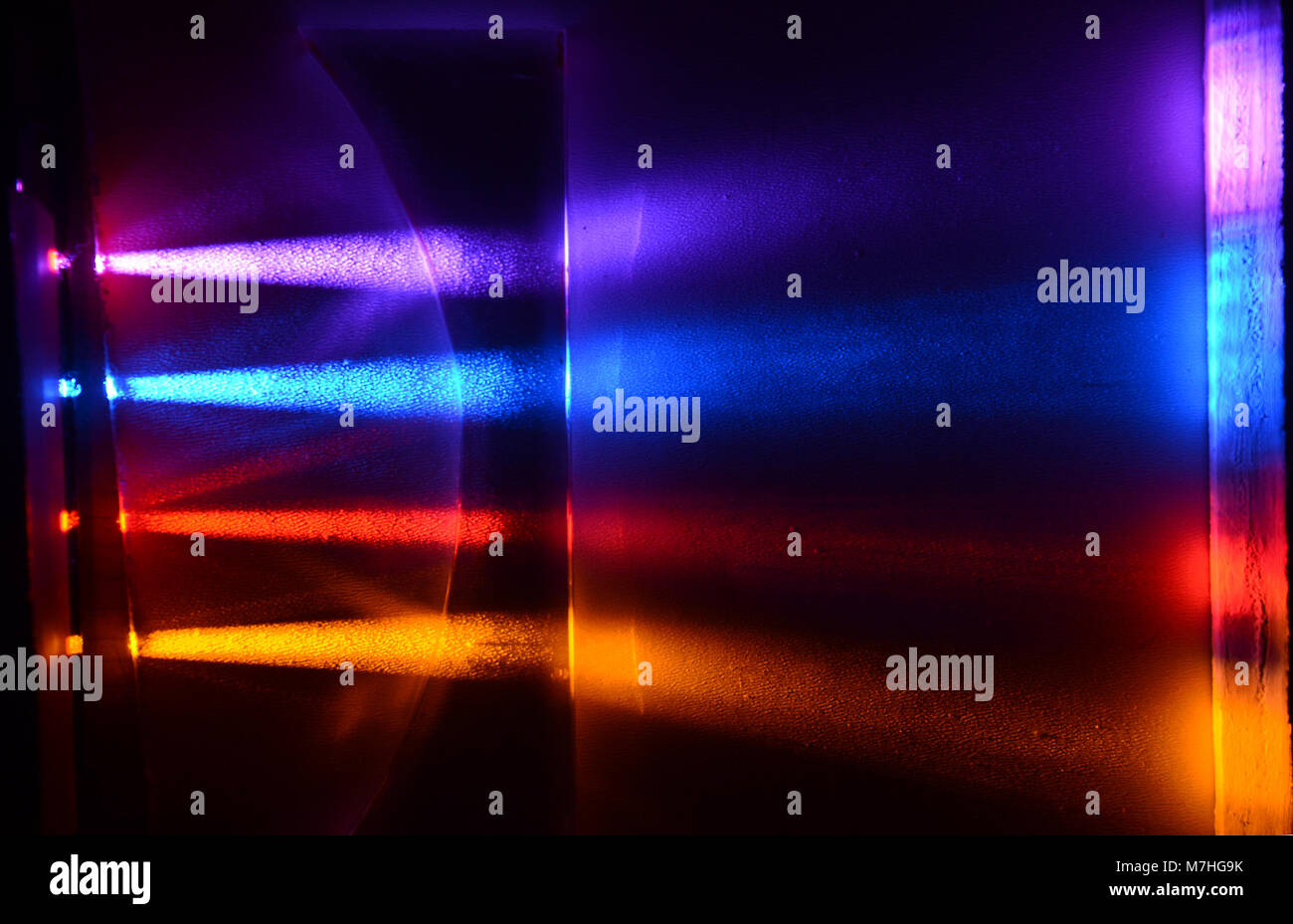 Light beams in colorblind-friendly colors pass trough a concave ...