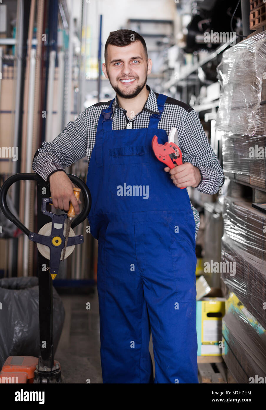 Male builder showing his working tools at workplace Stock Photo - Alamy