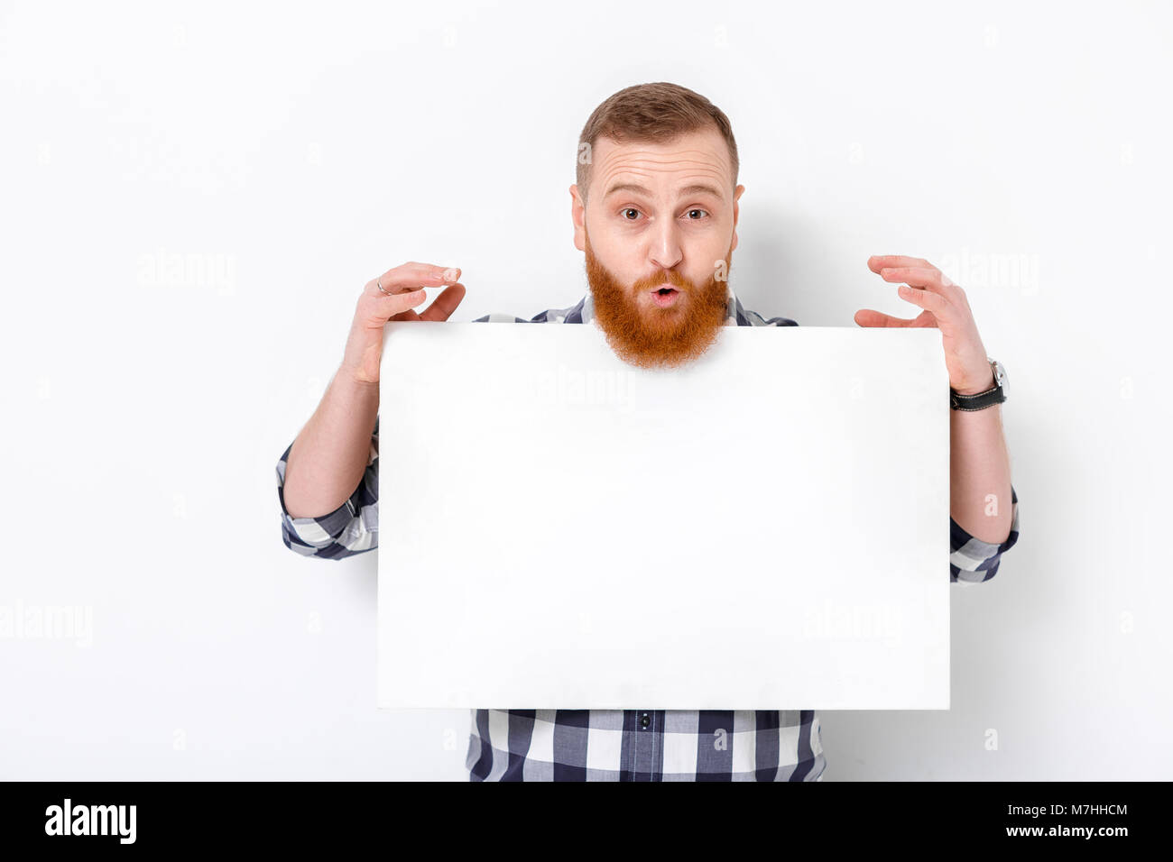handsome man with beard holding big white card. empty blank board Stock ...