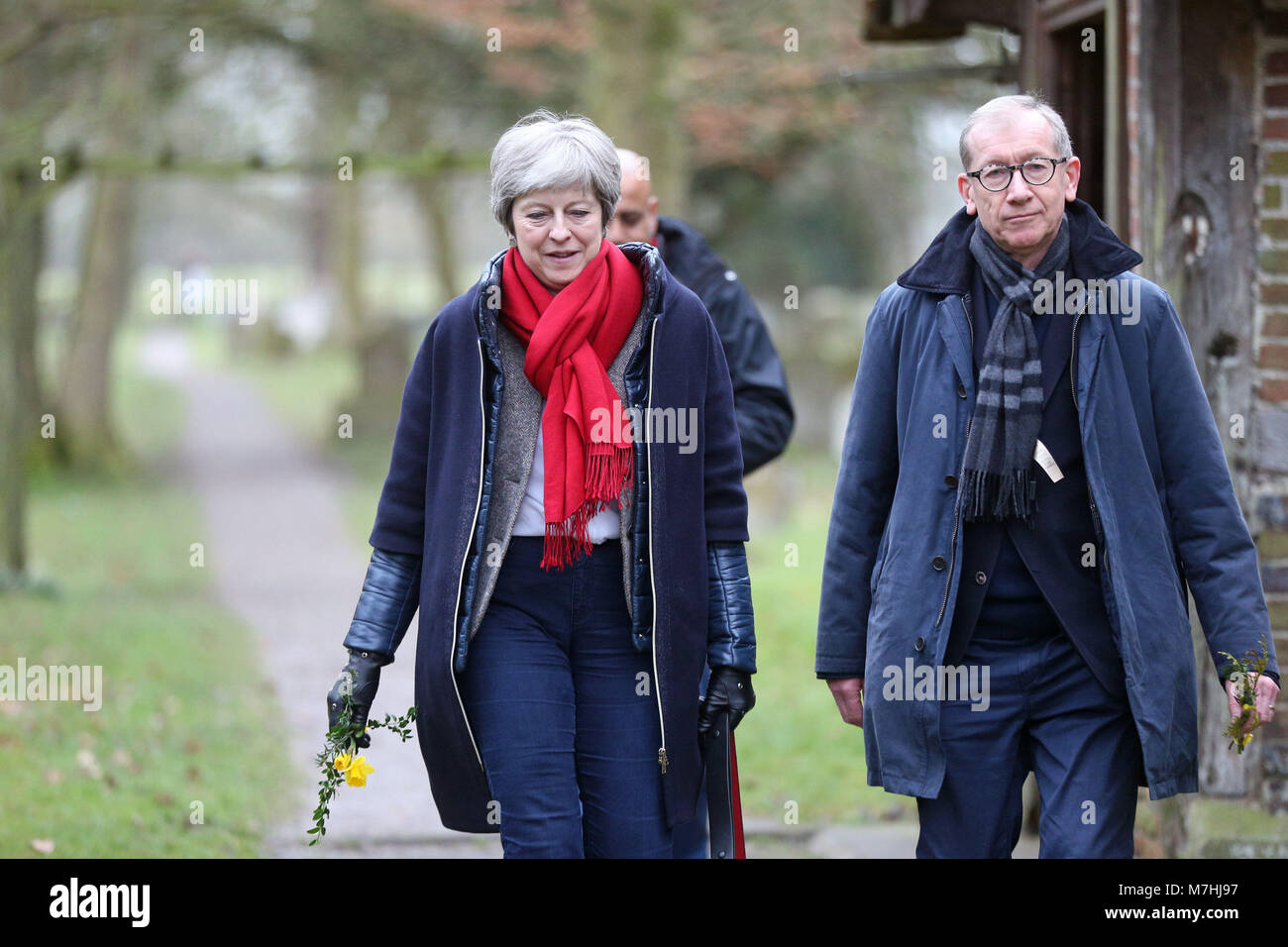 Prime Minister Theresa May and her husband Philip leave after attending ...