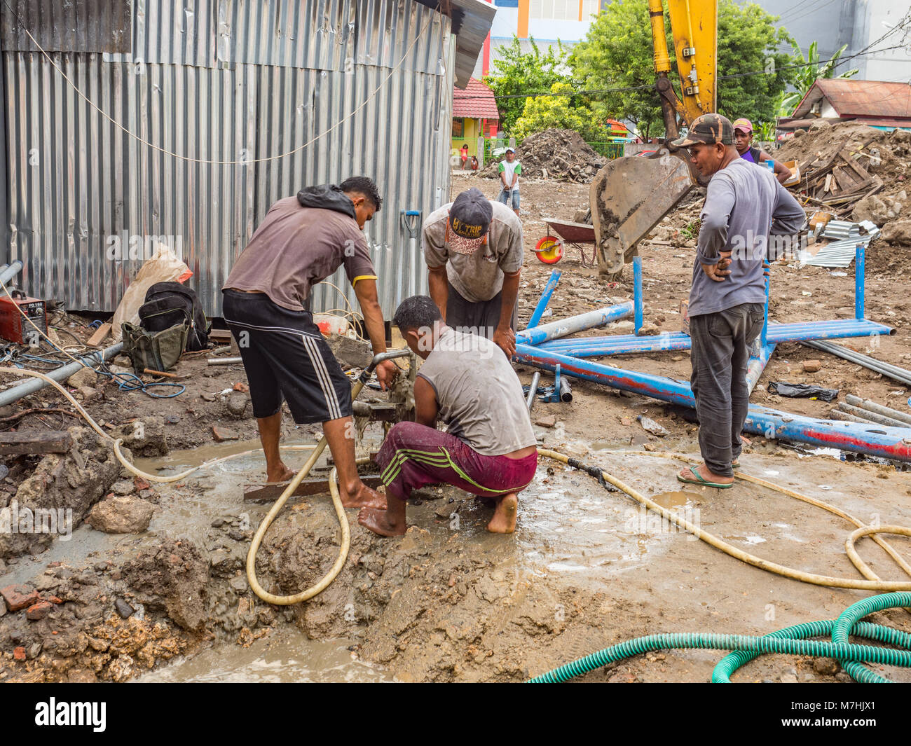 Ambon, Indonesia - February 17, 2018: Workers pumping the water at ...