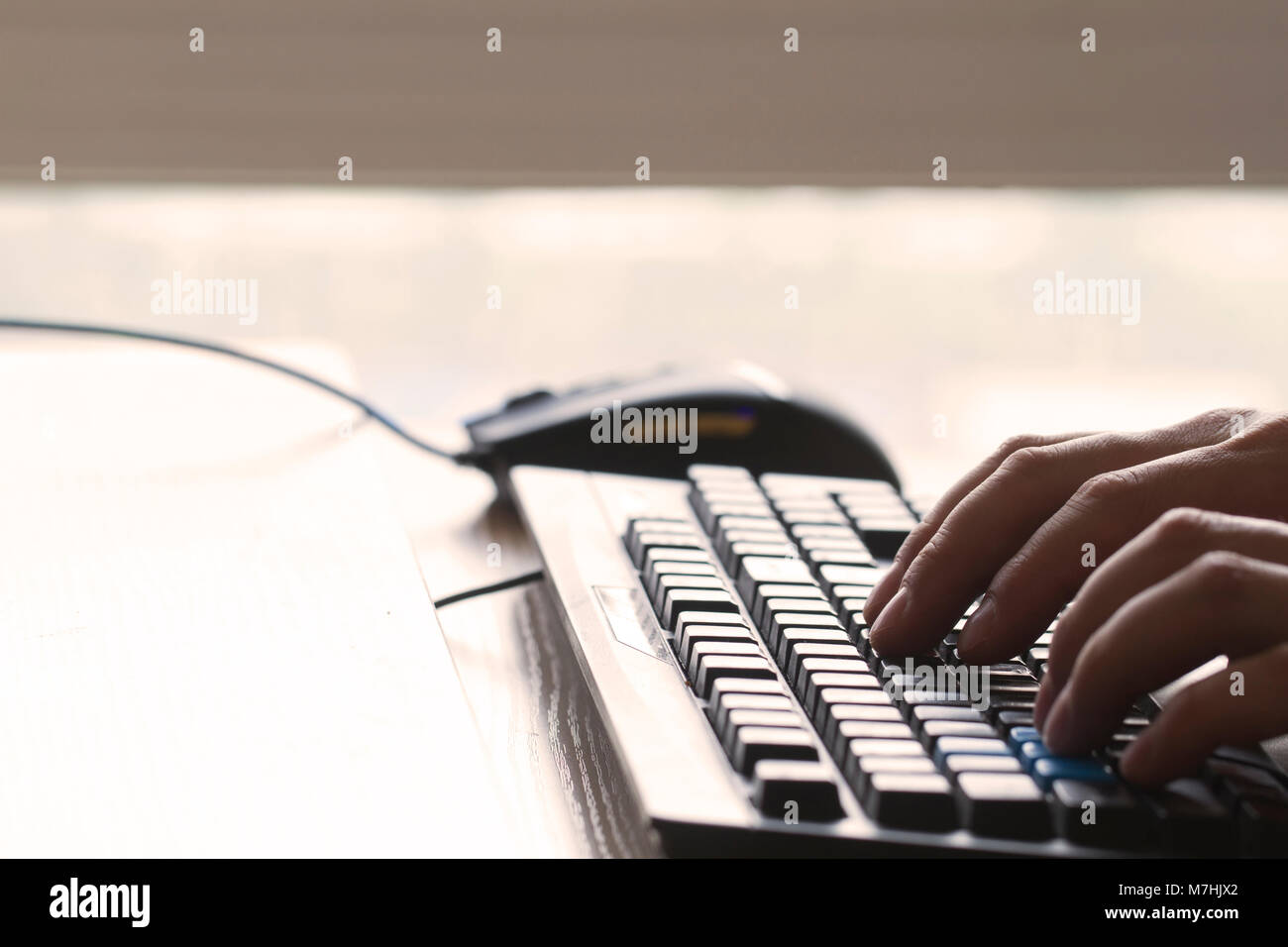 One hand and keyboard, hard work Stock Photo - Alamy