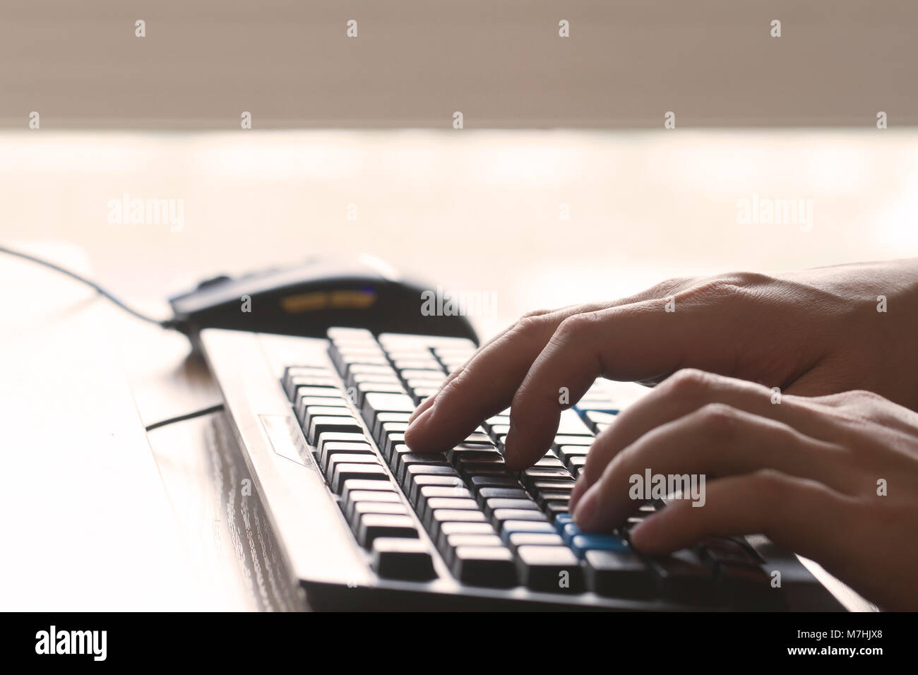 One hand and keyboard, hard work Stock Photo - Alamy