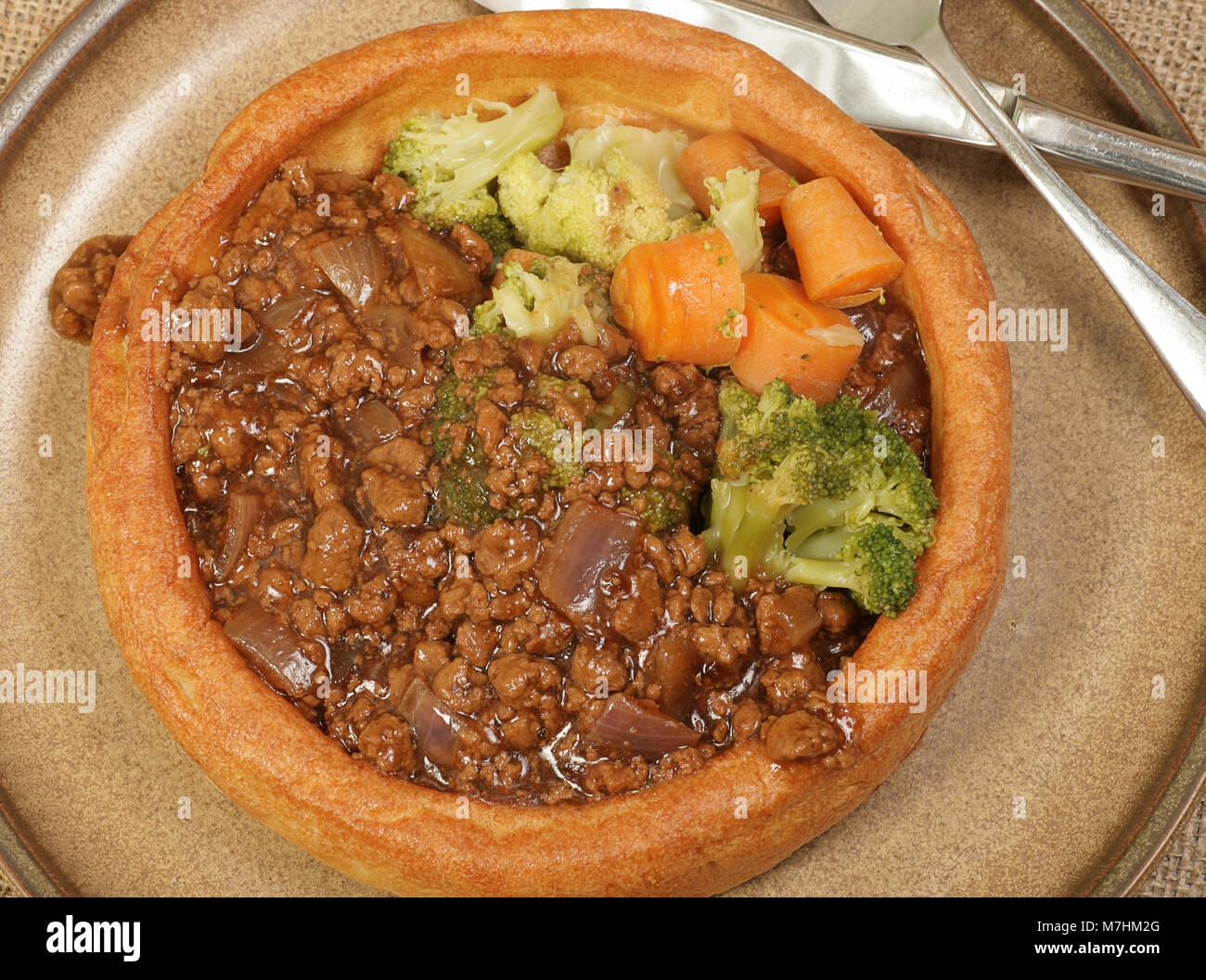 giant yorkshire pudding filled with mince and vegetables and gravy ...