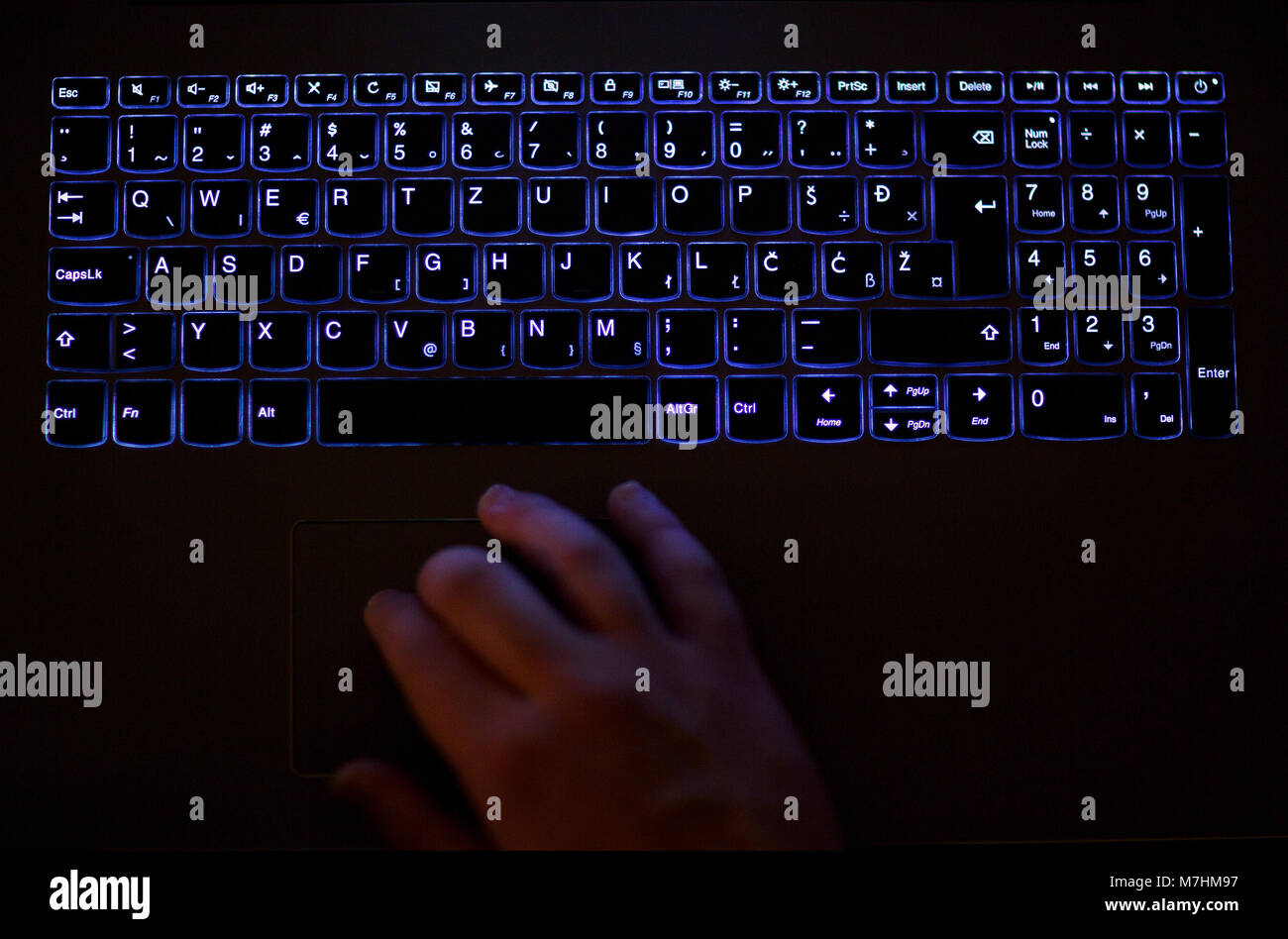 Late night internet addiction or working late man using laptop computer ...