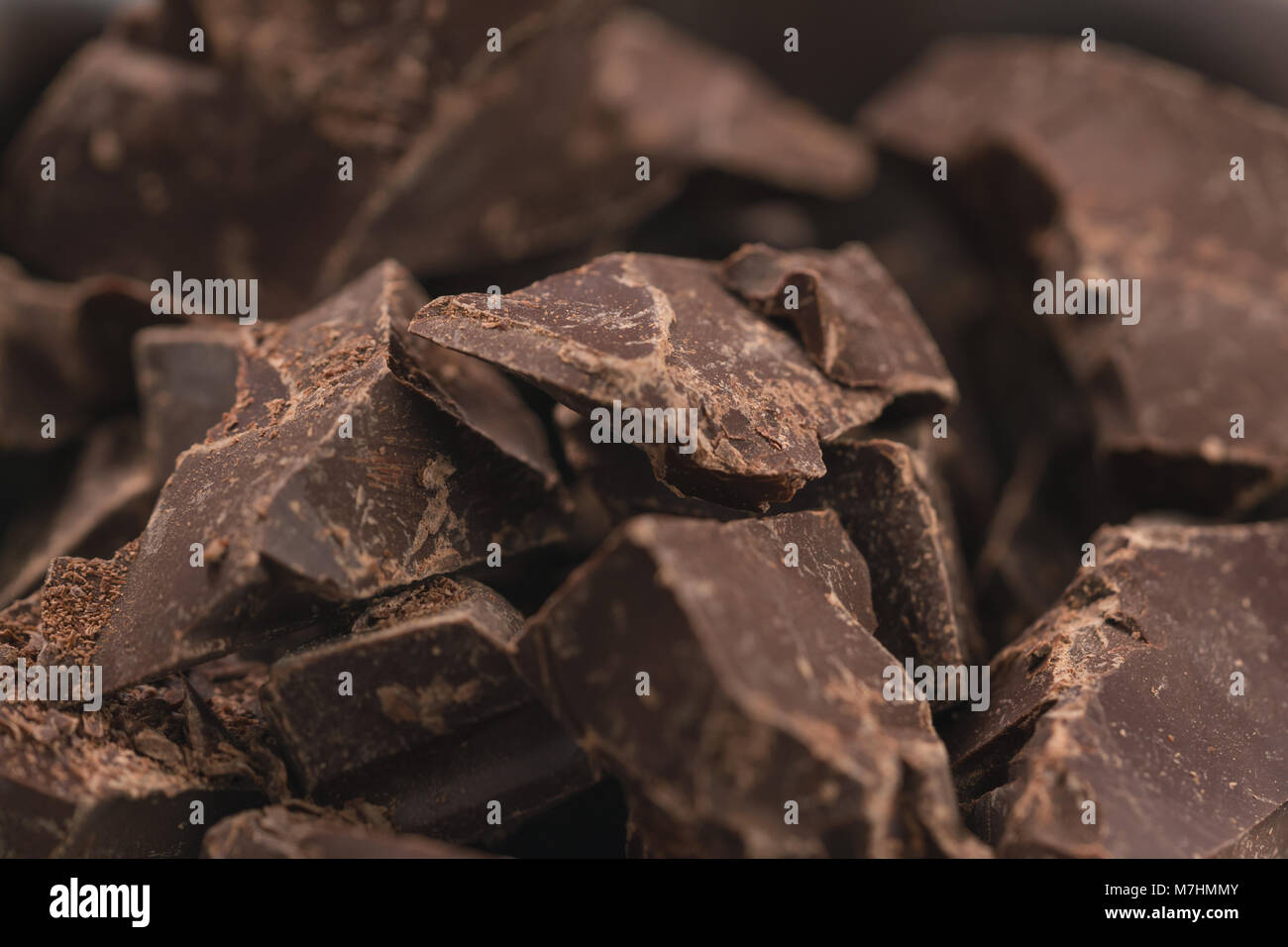 melting dark chocolate chunks in steel bowl, closeup Stock Photo - Alamy
