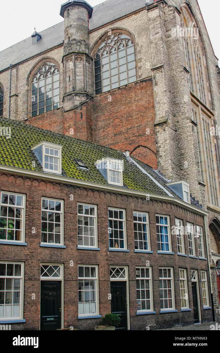 Medieval houses close to a medieval church in Dutch town of Leiden ...