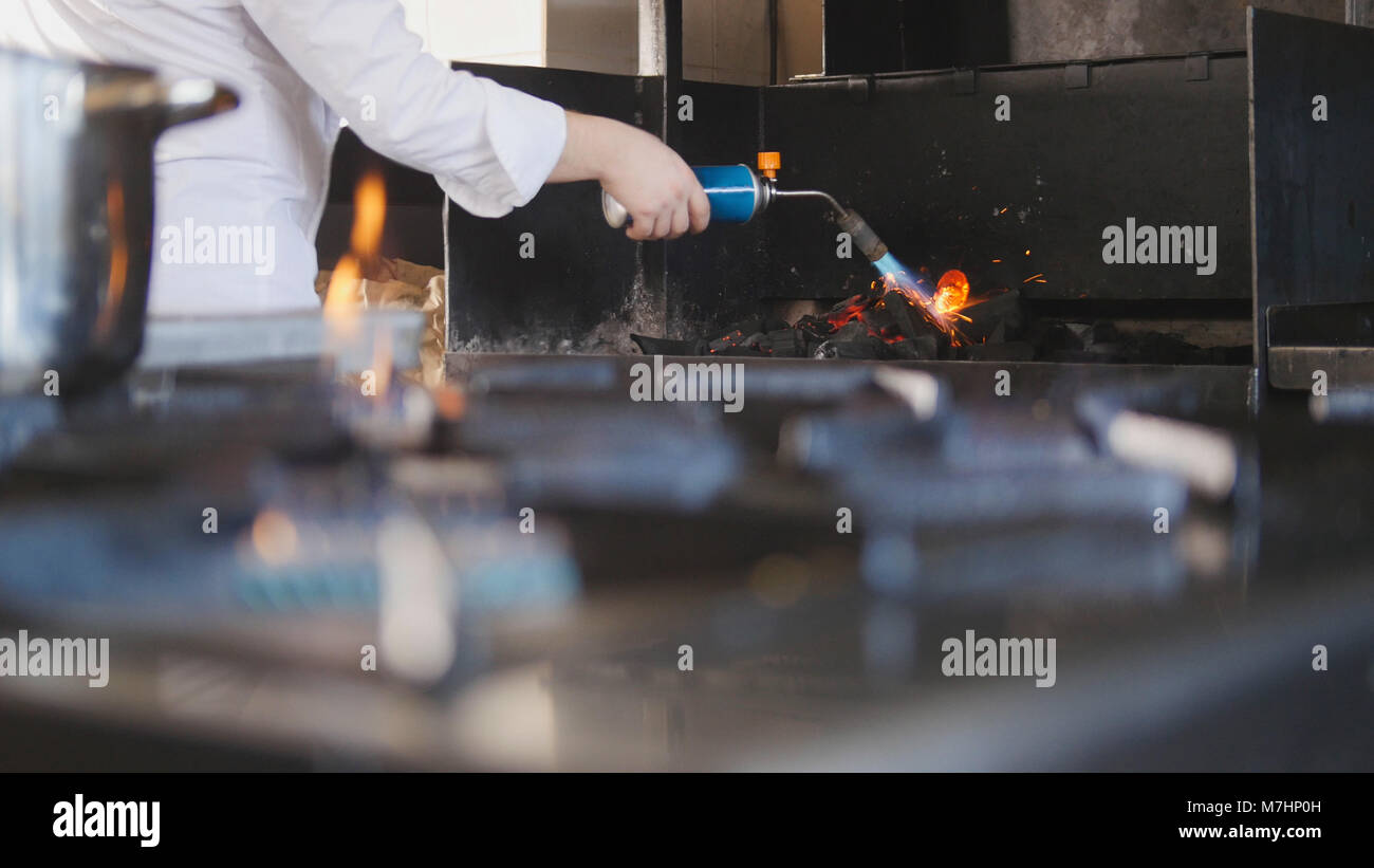 Ignition of charcoal in the barbecue oven Stock Photo - Alamy
