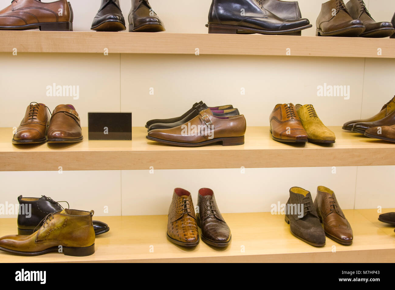 Display of beautiful leather man's shoes in shop Stock Photo - Alamy
