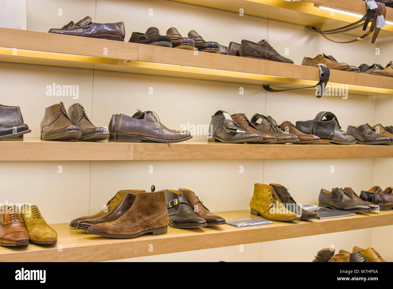 Display of beautiful leather man's shoes in shop Stock Photo - Alamy