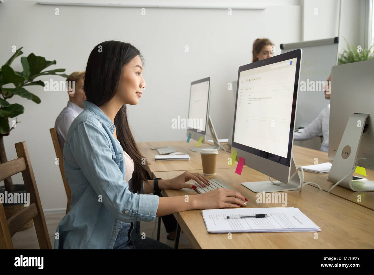 Young asian businesswoman using computer working online in cowor Stock ...