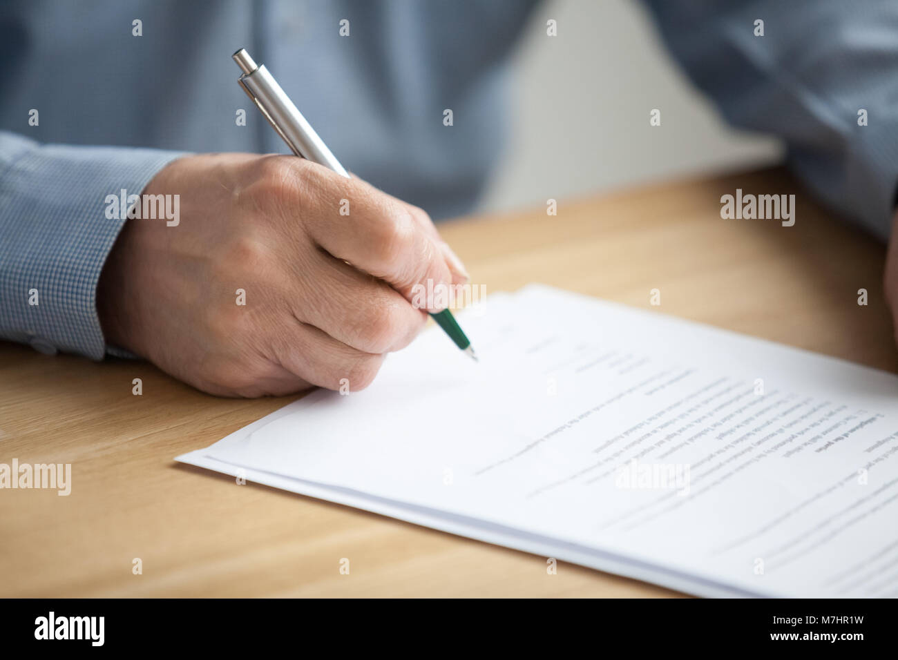 Male hand signing document, senior man putting signature on pape Stock ...