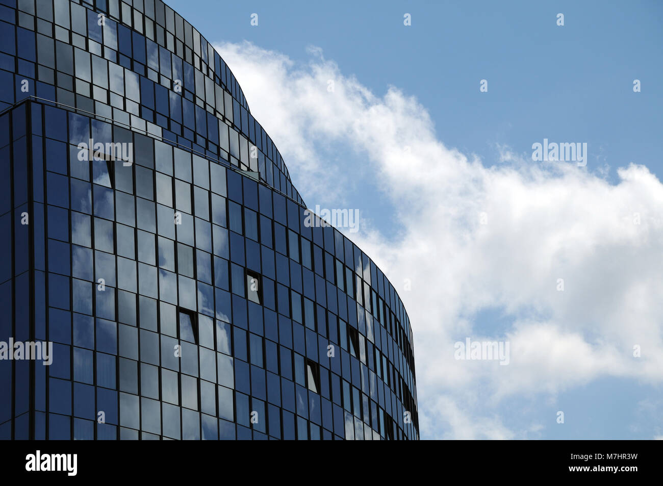 glass facade reflecting sky and clouds Stock Photo - Alamy