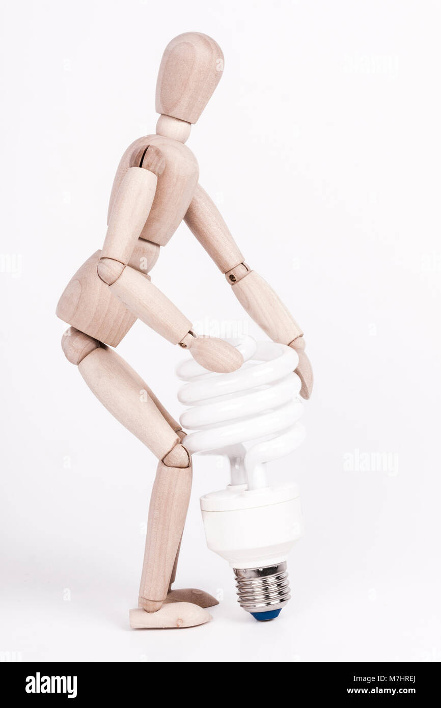 Puppet with the energy saving lamp Stock Photo - Alamy