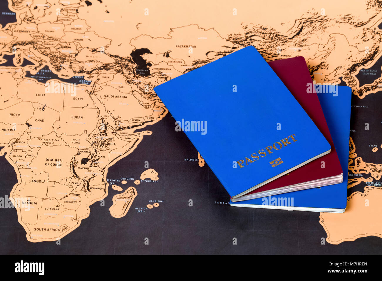 three passports on a geographical map, background image, concept travel ...