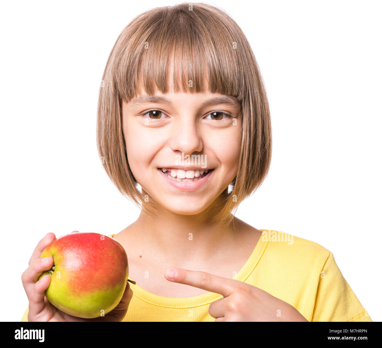 Little girl with apple Stock Photo - Alamy