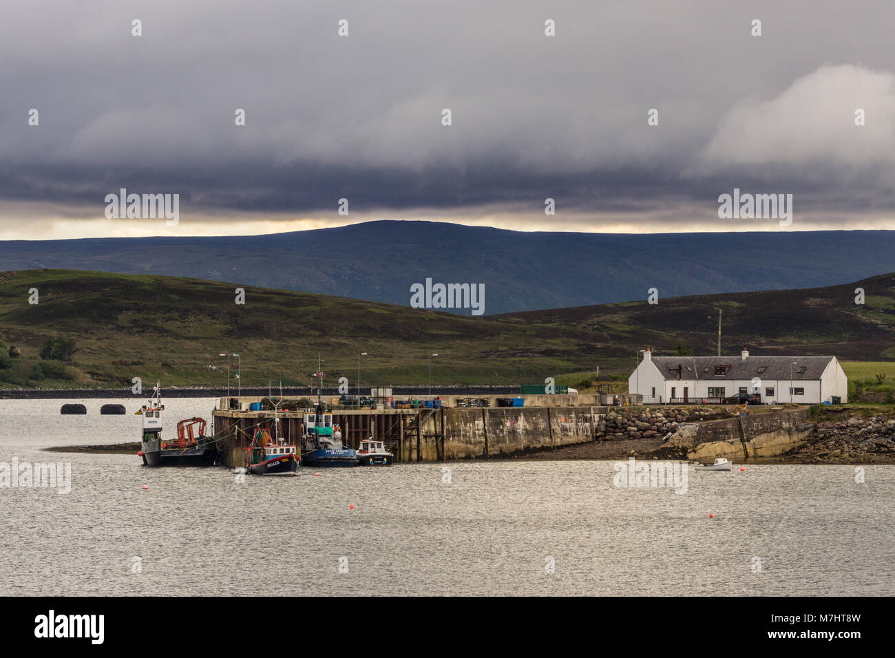 Aultbea, Scotland - June 8, 2012: Calm waters of Loch Ewe with the pier ...